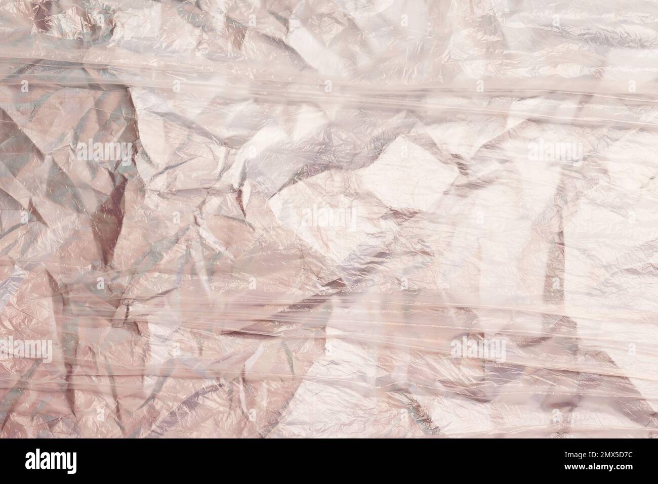 cellophane on metallic crumpled blue background. plastic textures ...