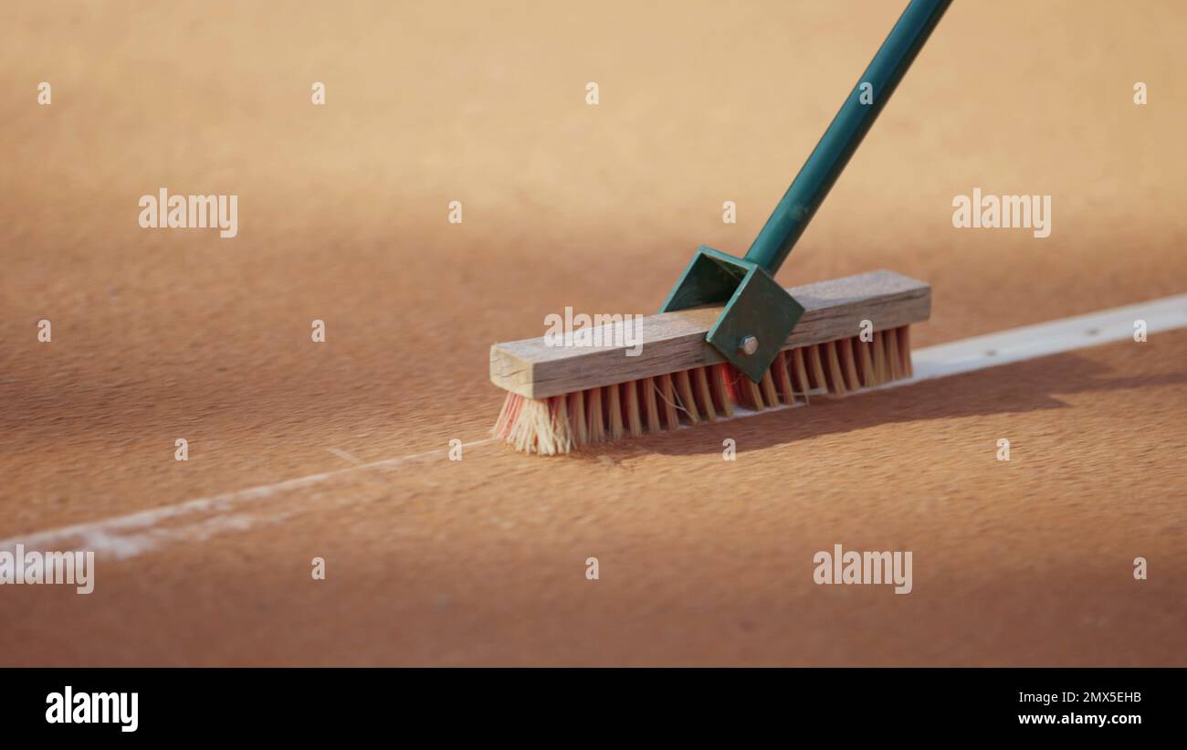 Cleaning marking line clay tennis court with brush. Clay tennis court ...