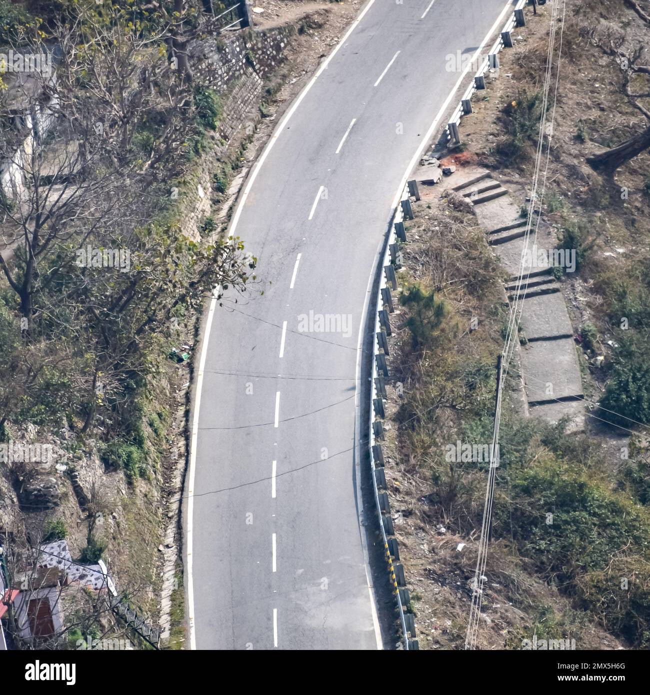 Aerial top view of traffic vehicles driving at mountains roads at ...