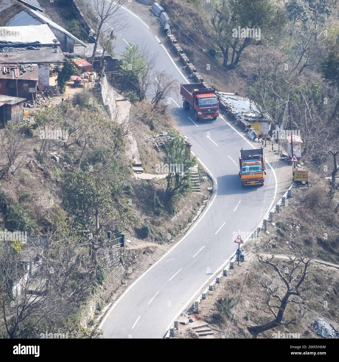 Aerial top view of traffic vehicles driving at mountains roads at ...