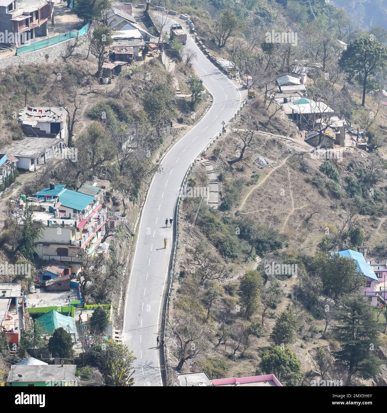 Aerial top view of traffic vehicles driving at mountains roads at ...