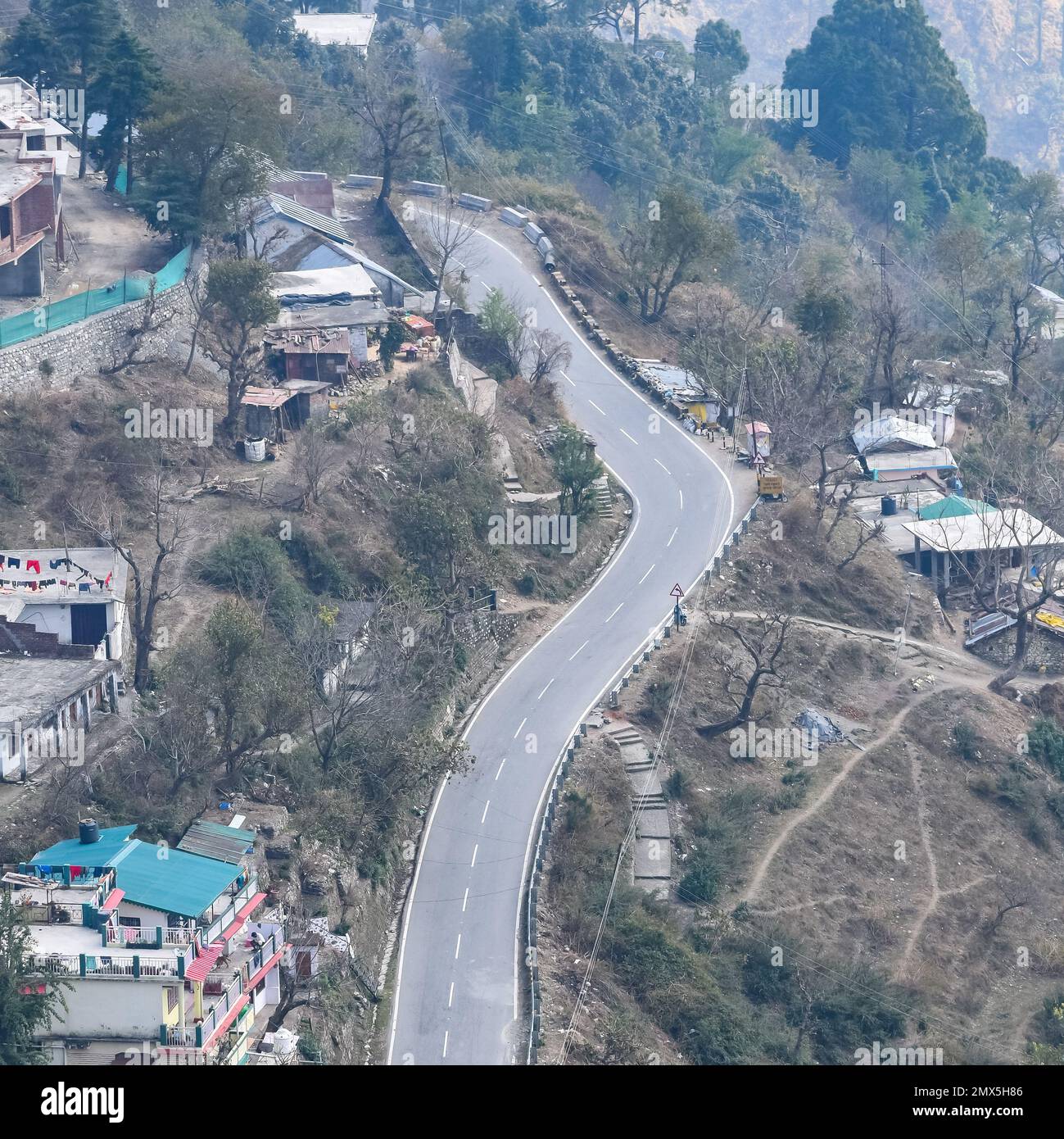 Aerial top view of traffic vehicles driving at mountains roads at ...