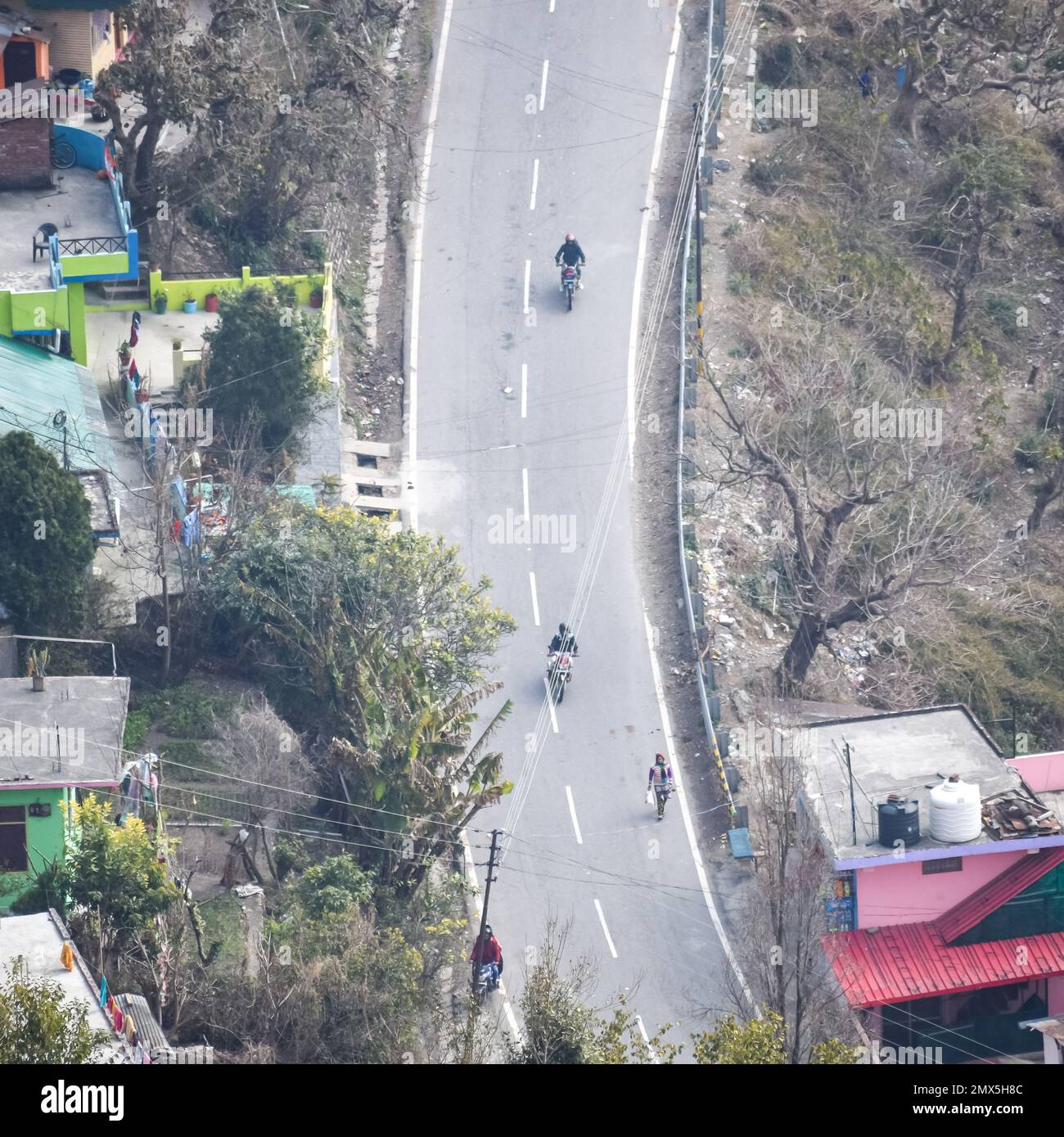 Aerial top view of traffic vehicles driving at mountains roads at ...
