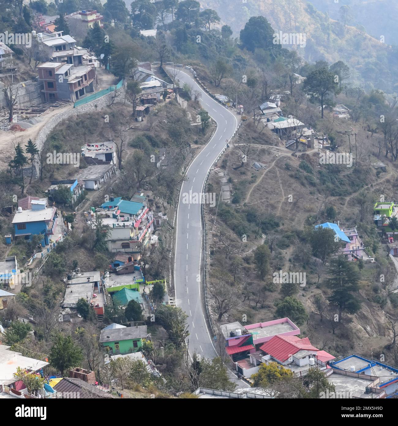Aerial top view of traffic vehicles driving at mountains roads at ...