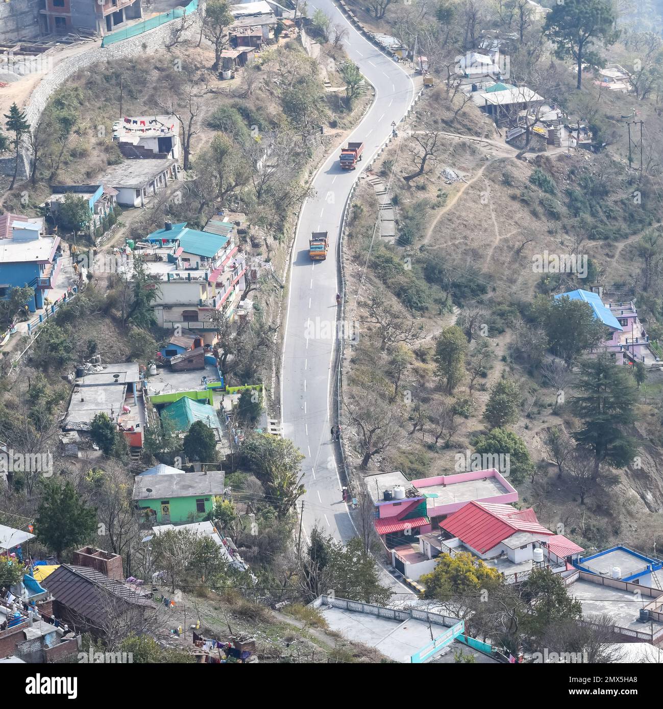 Aerial top view of traffic vehicles driving at mountains roads at ...