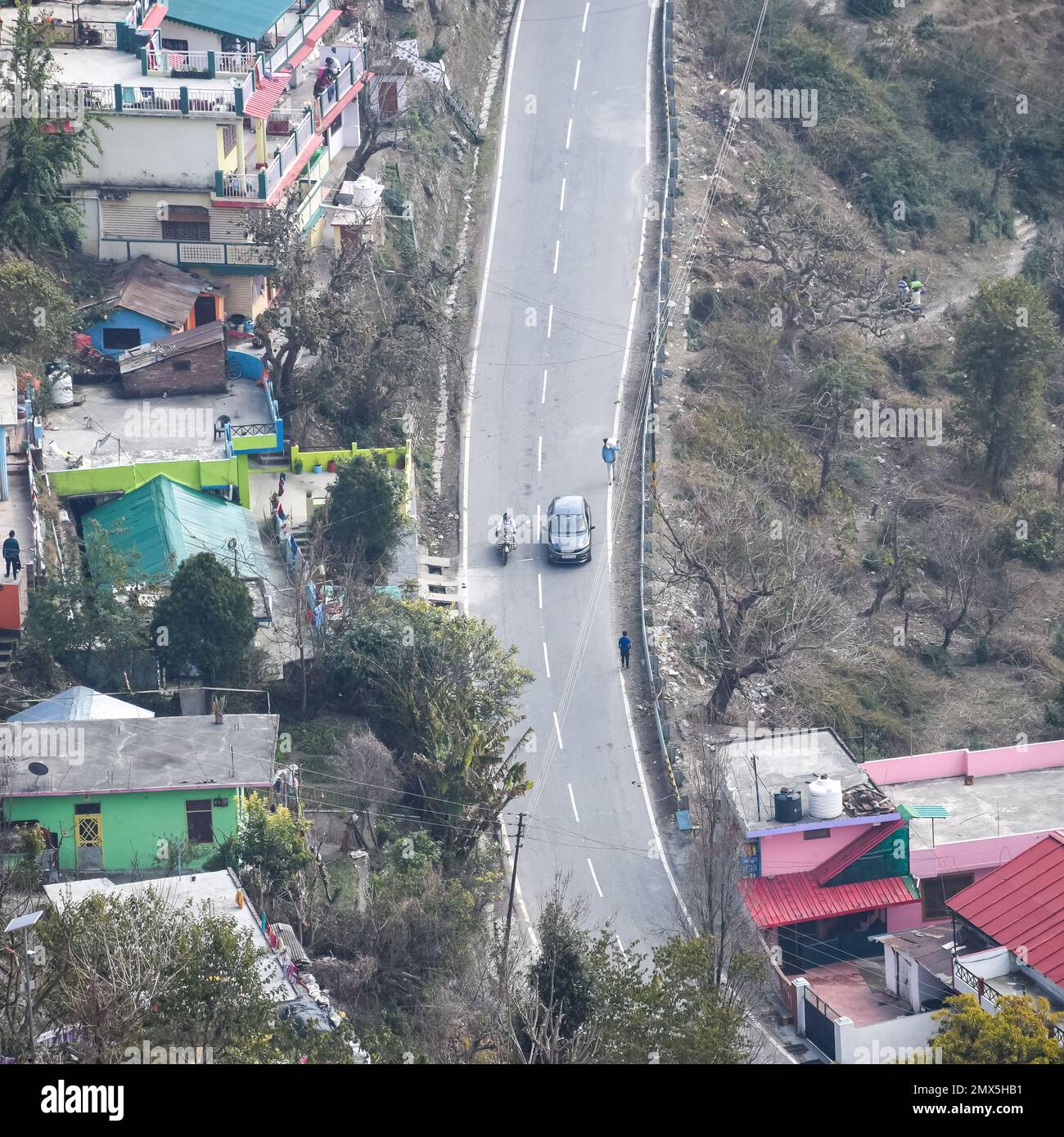 Aerial top view of traffic vehicles driving at mountains roads at ...