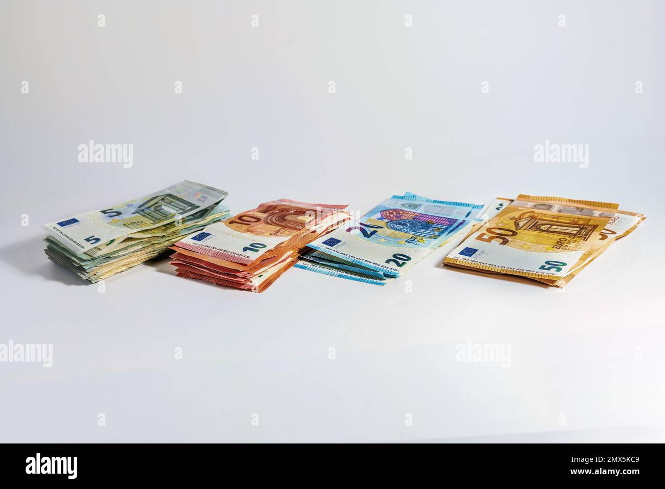 Stacks of banknotes, value of five, ten, twenty and fifty euro on a ...
