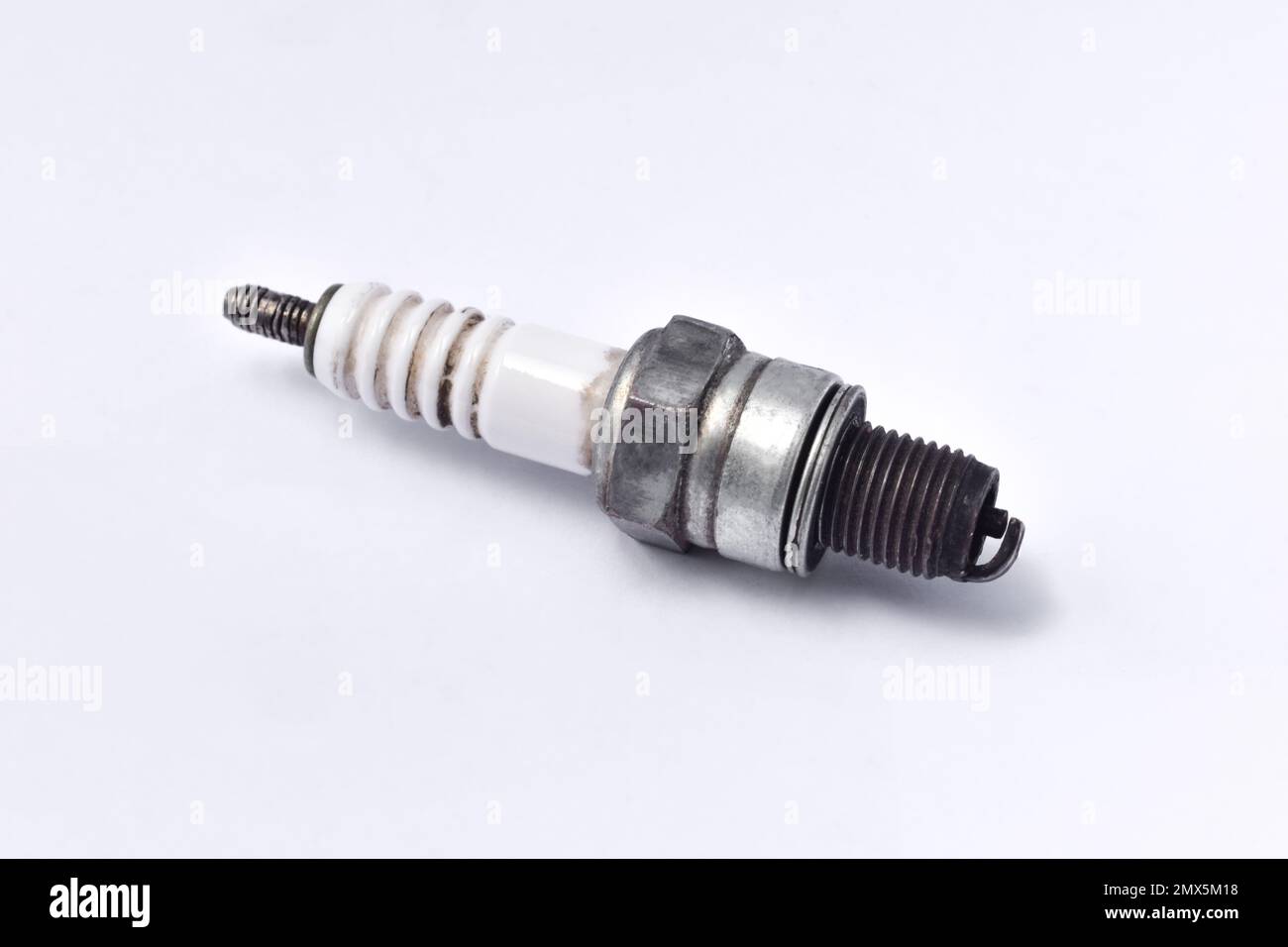 Used motorcycle spark plug isolated on white background Stock Photo - Alamy