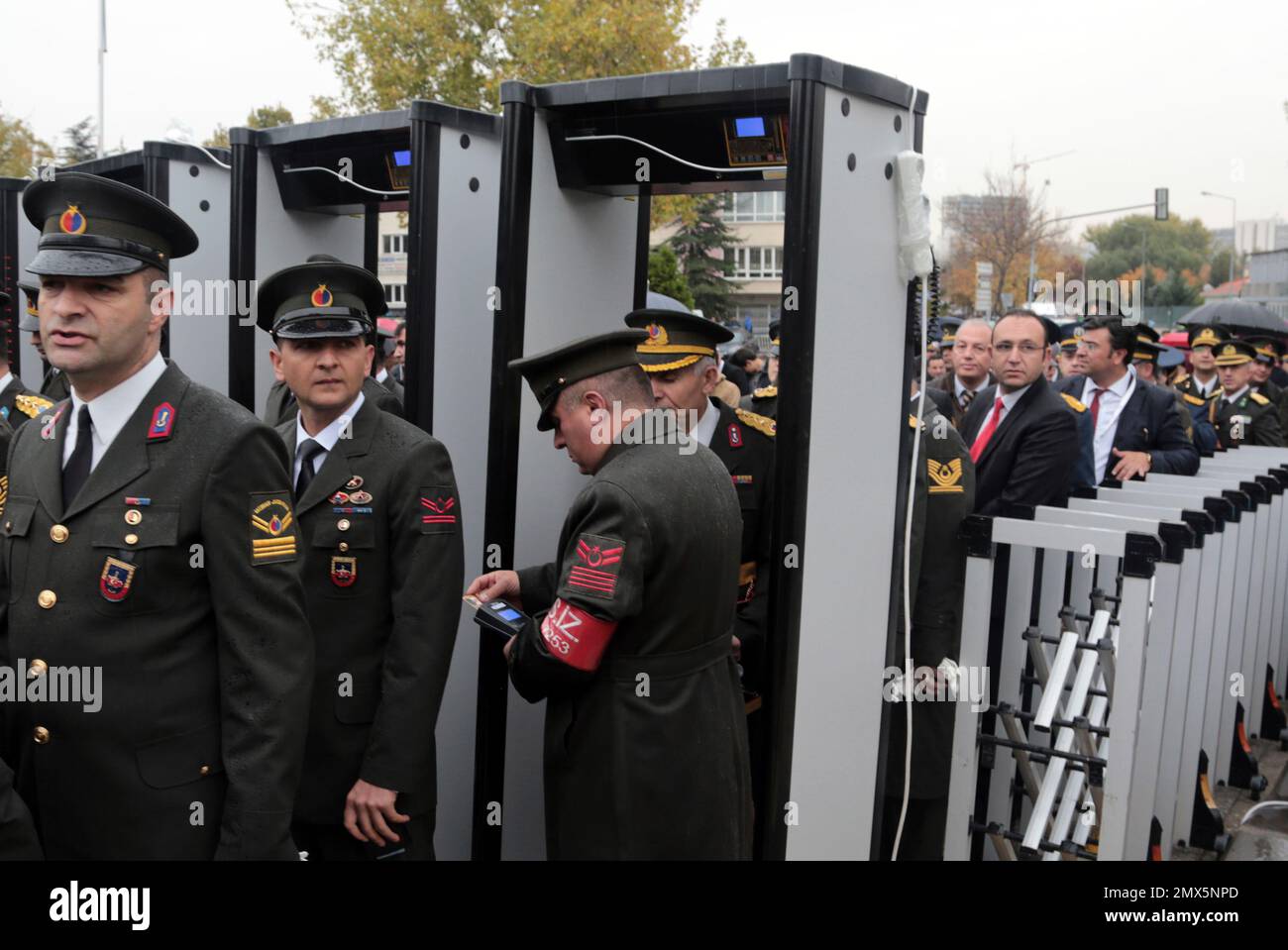A Turkish army officer checks IDs of his colleagues as they arrive for ...