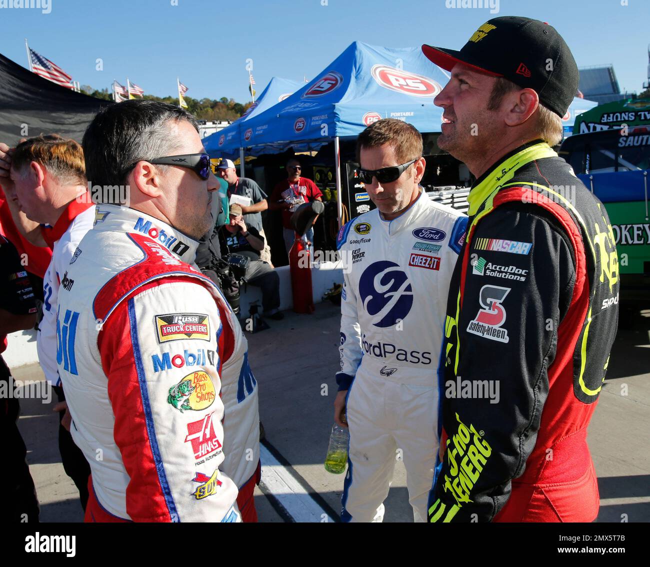 Sprint Cup Series driver Tony Stewart, left, talks with Greg Biffle ...