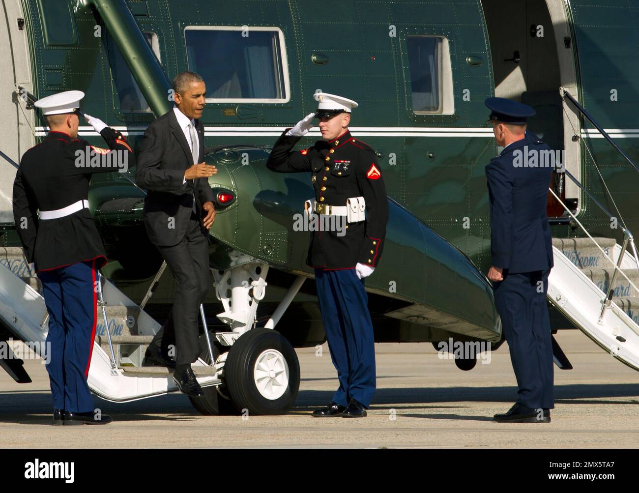 President Barack Obama steps off Marine One before boarding Air Force ...
