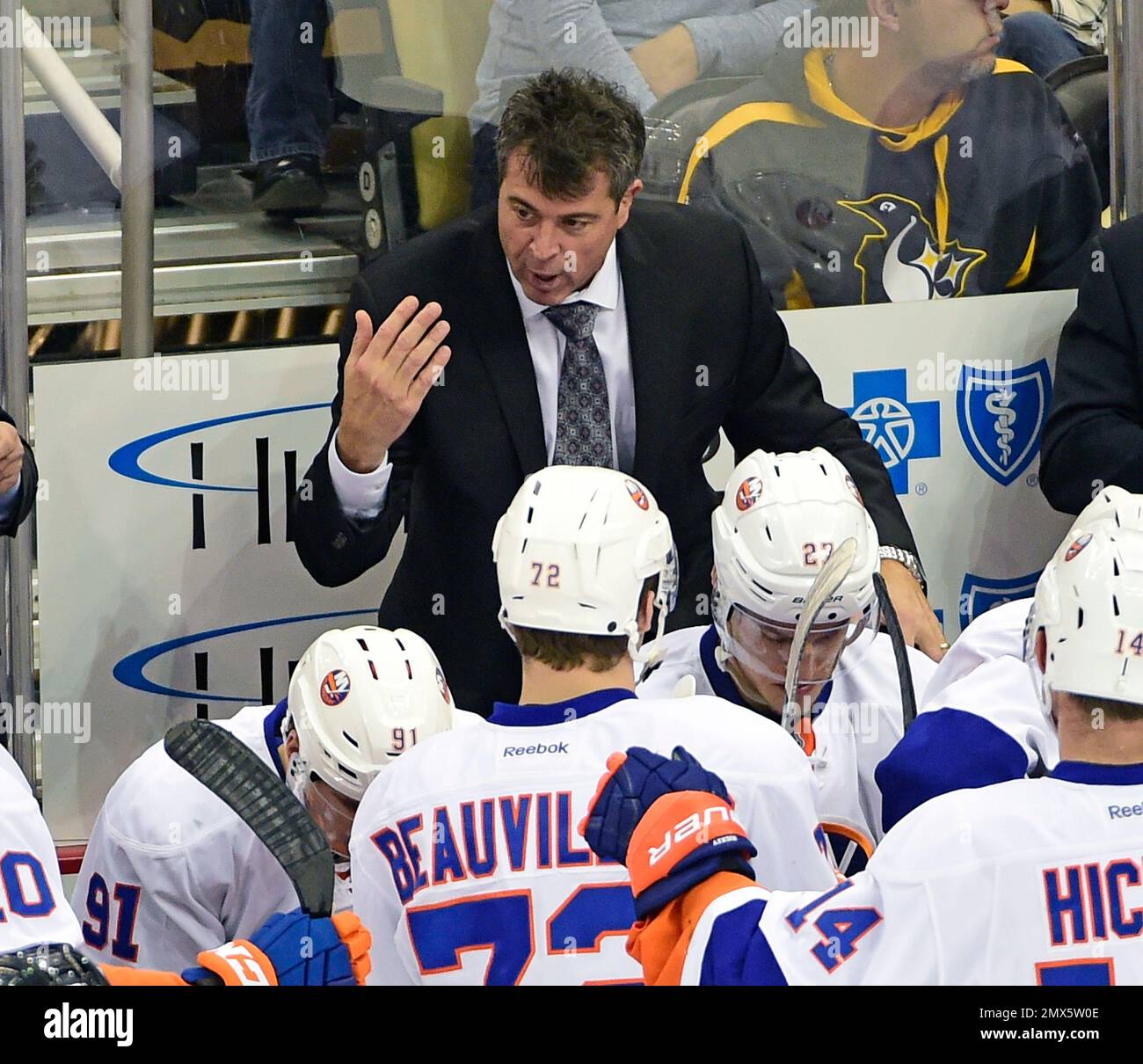 New York Islanders head coach Jack Capuano talks to his team during an ...