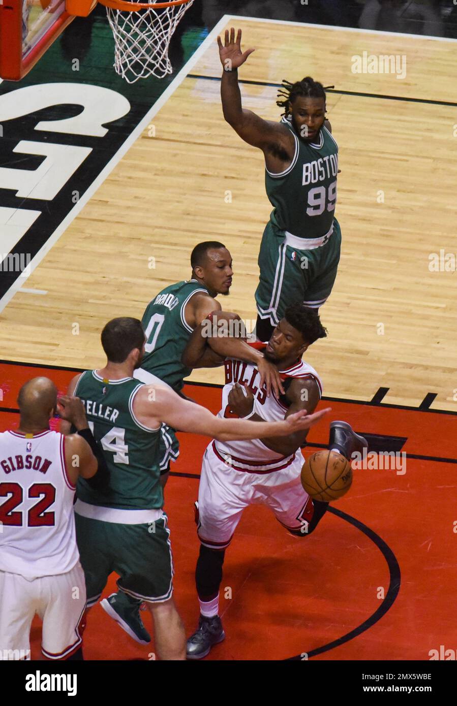 Chicago Bulls' Jimmy Butler (21) is fouled by Boston Celtics' Avery ...