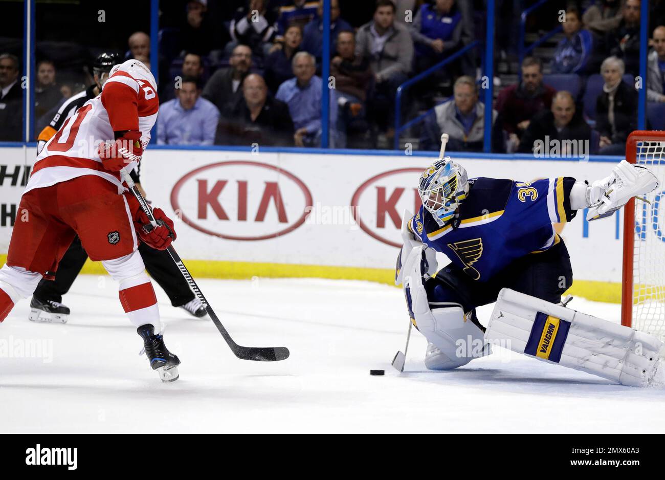 Detroit Red Wings' Henrik Zetterberg, left, of Sweden, scores the ...