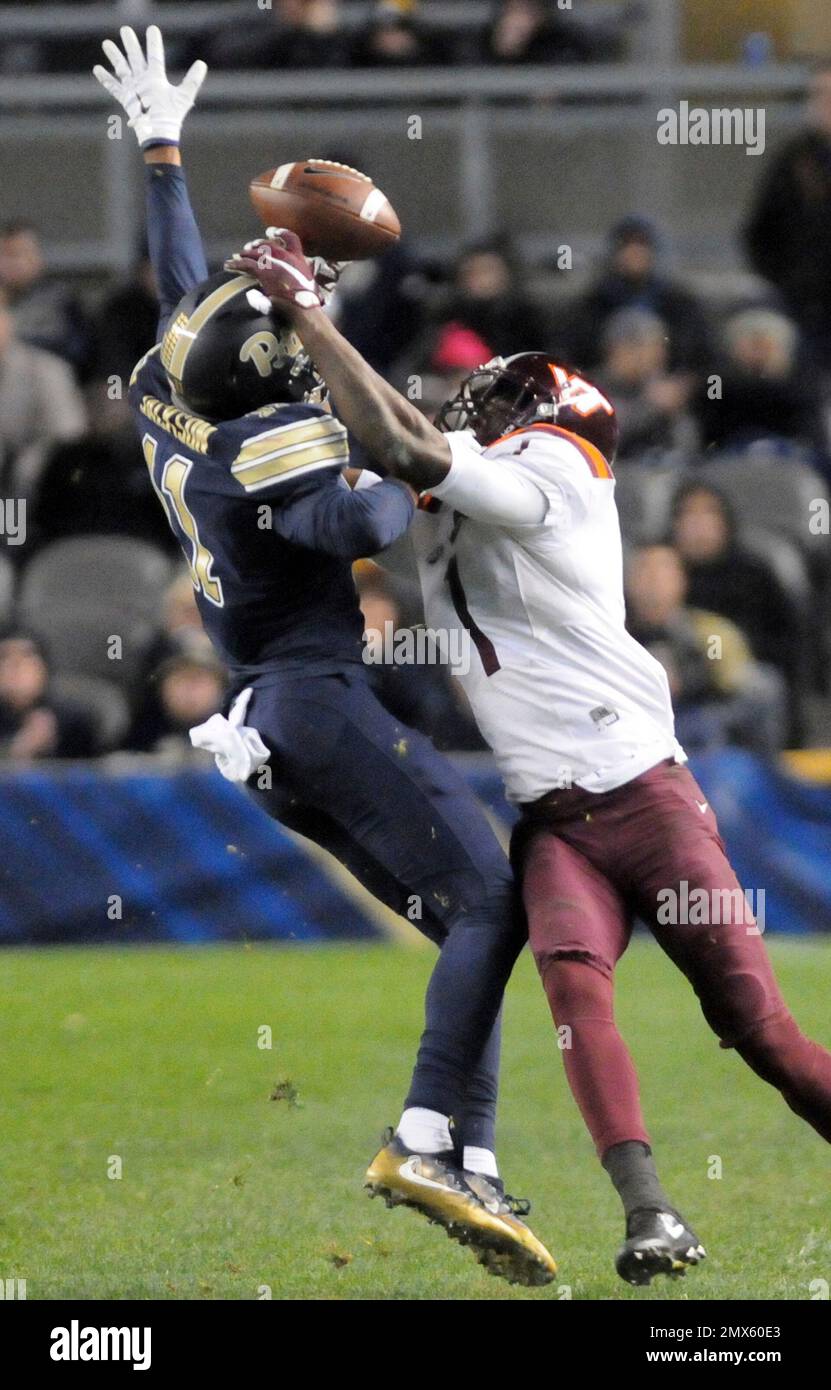 Pittsburgh defensive back Dane Jackson, left, cannot stop a completed ...