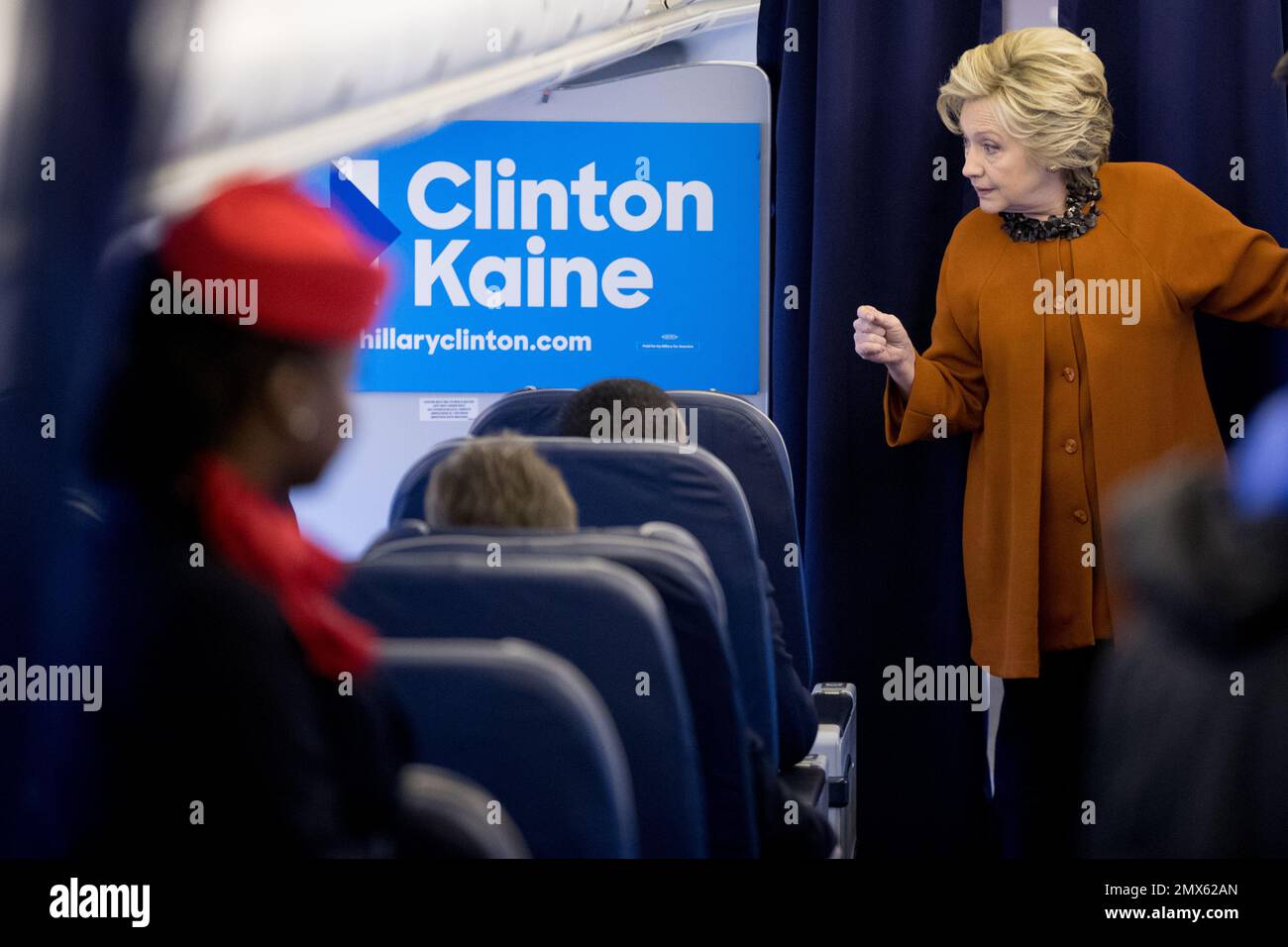 Democratic presidential candidate Hillary Clinton speaks with aides ...