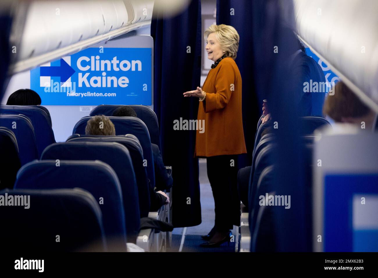 Democratic presidential candidate Hillary Clinton speaks with aides ...