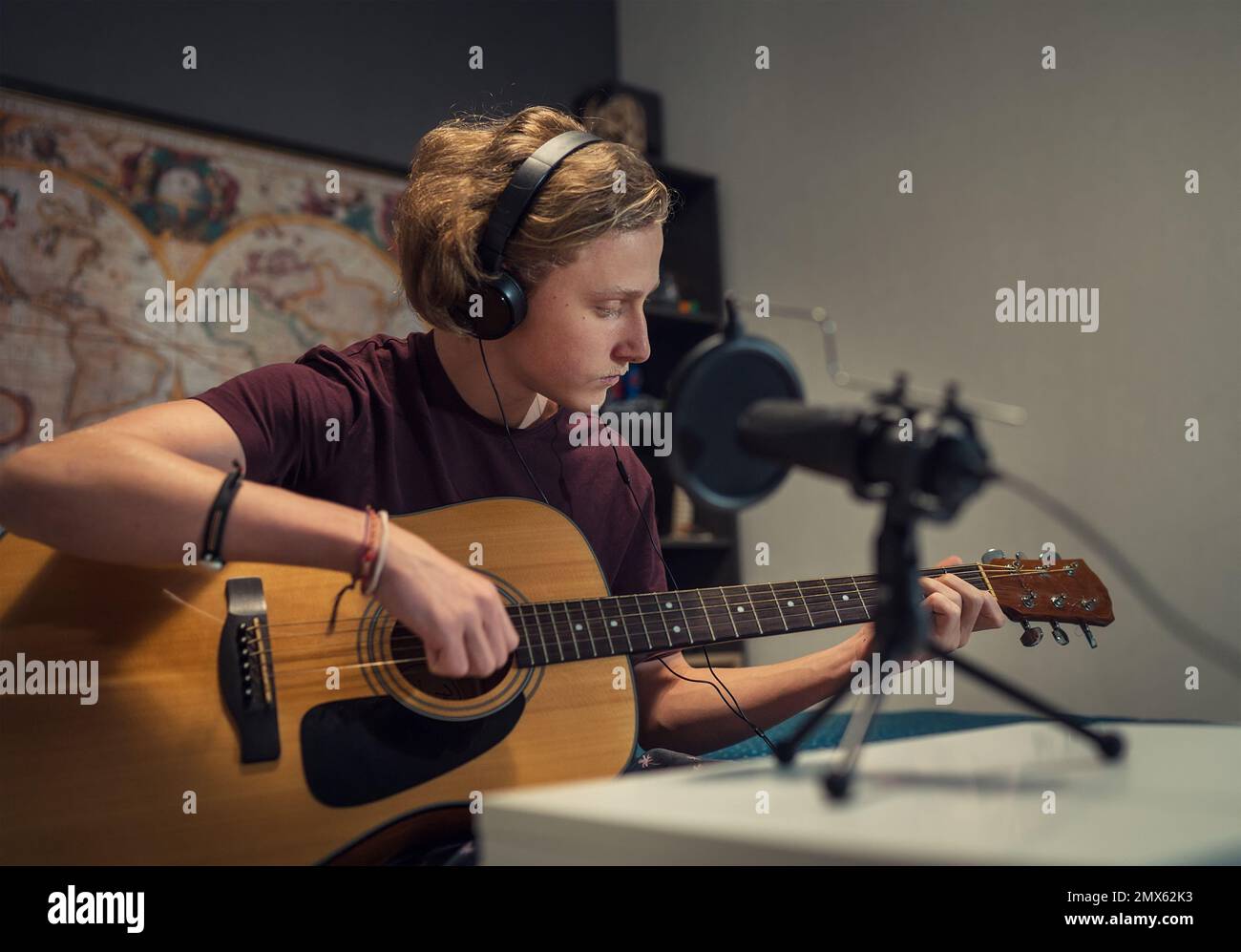 Microphone with pop filter closeup photo with a young teenager boy in ...