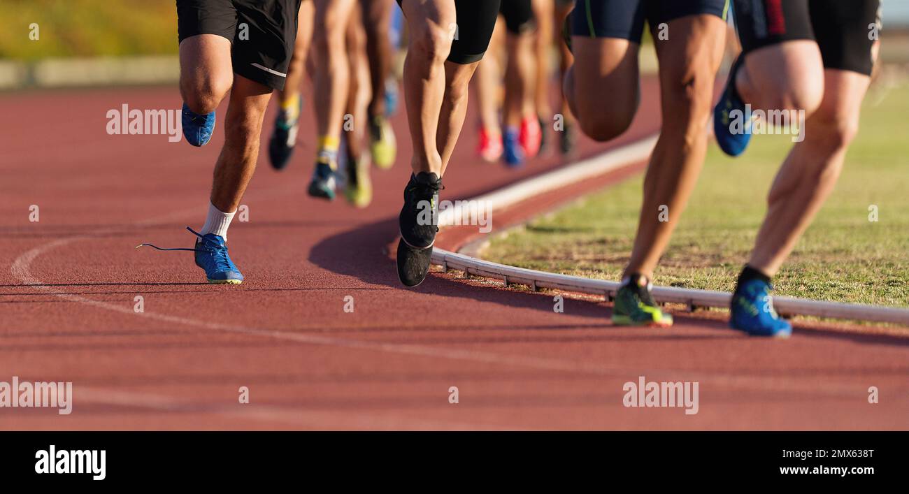 Athletics people running on the track field Stock Photo - Alamy
