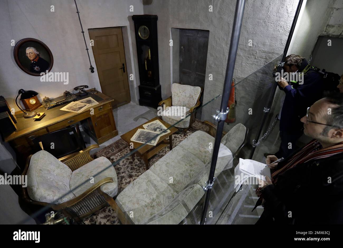 Journalists look at a replica of the living room and office of Adolf ...