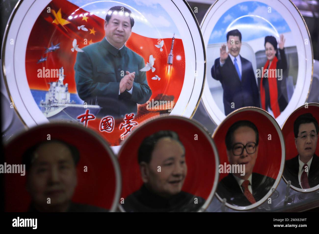 Porcelain plates baring images of Chinese President Xi Jinping and his ...