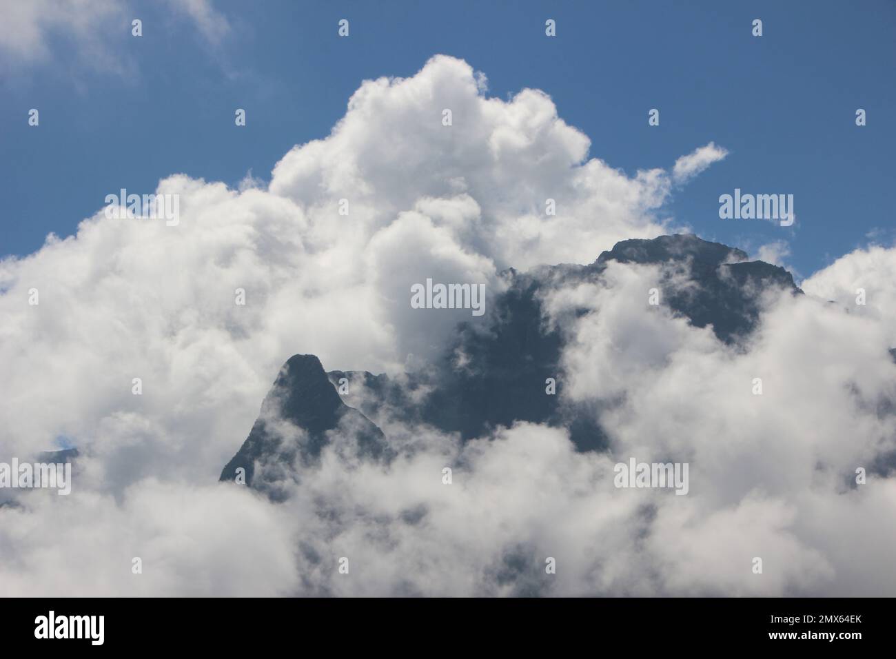 mountain hiding behind clouds Stock Photo - Alamy