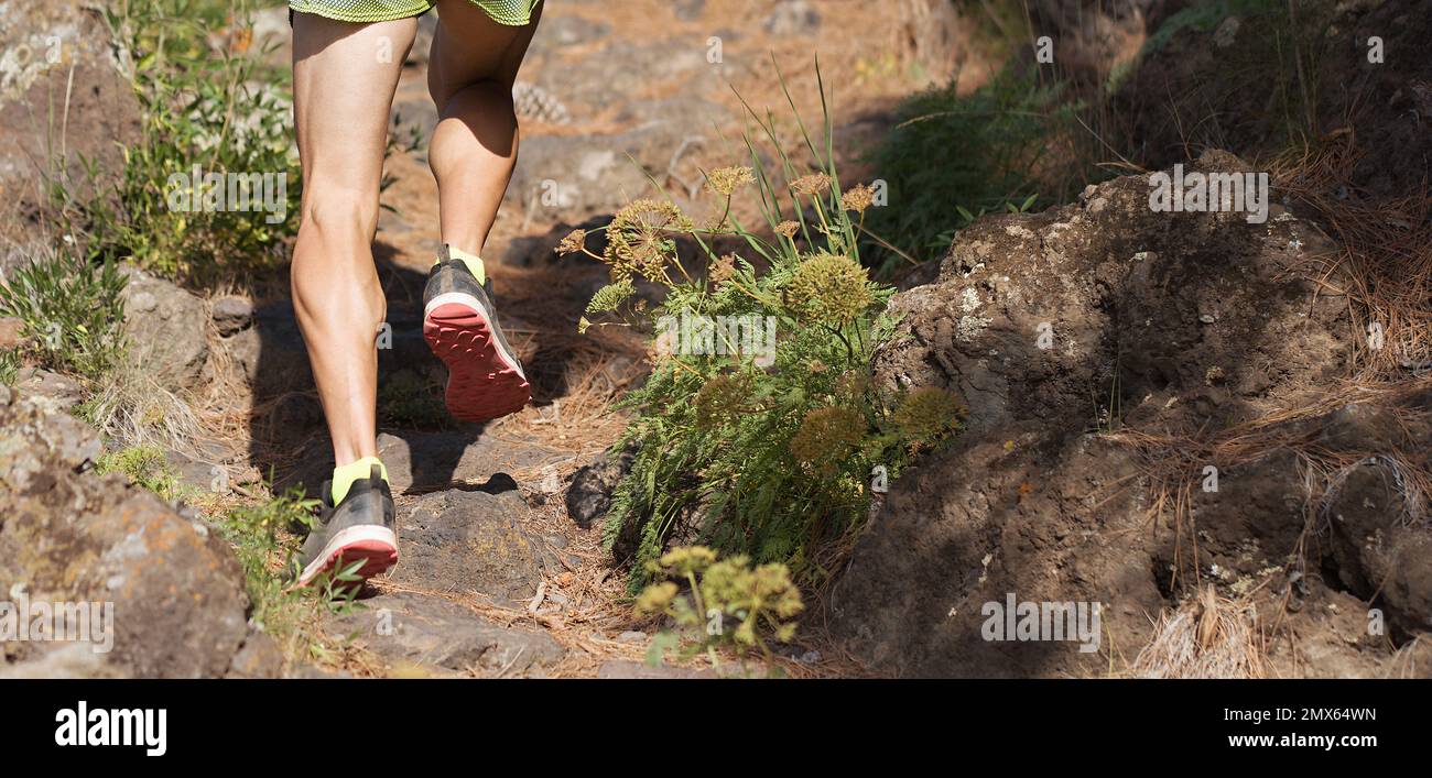 Trail running man on mountain path exercising Stock Photo - Alamy