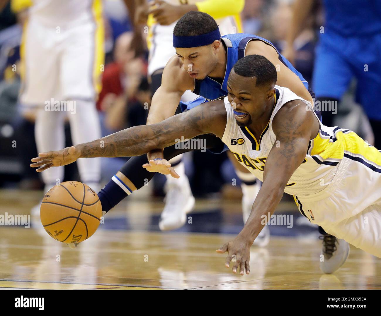 Indiana Pacers' Rodney Stuckey and Dallas Mavericks' Seth Curry dive ...