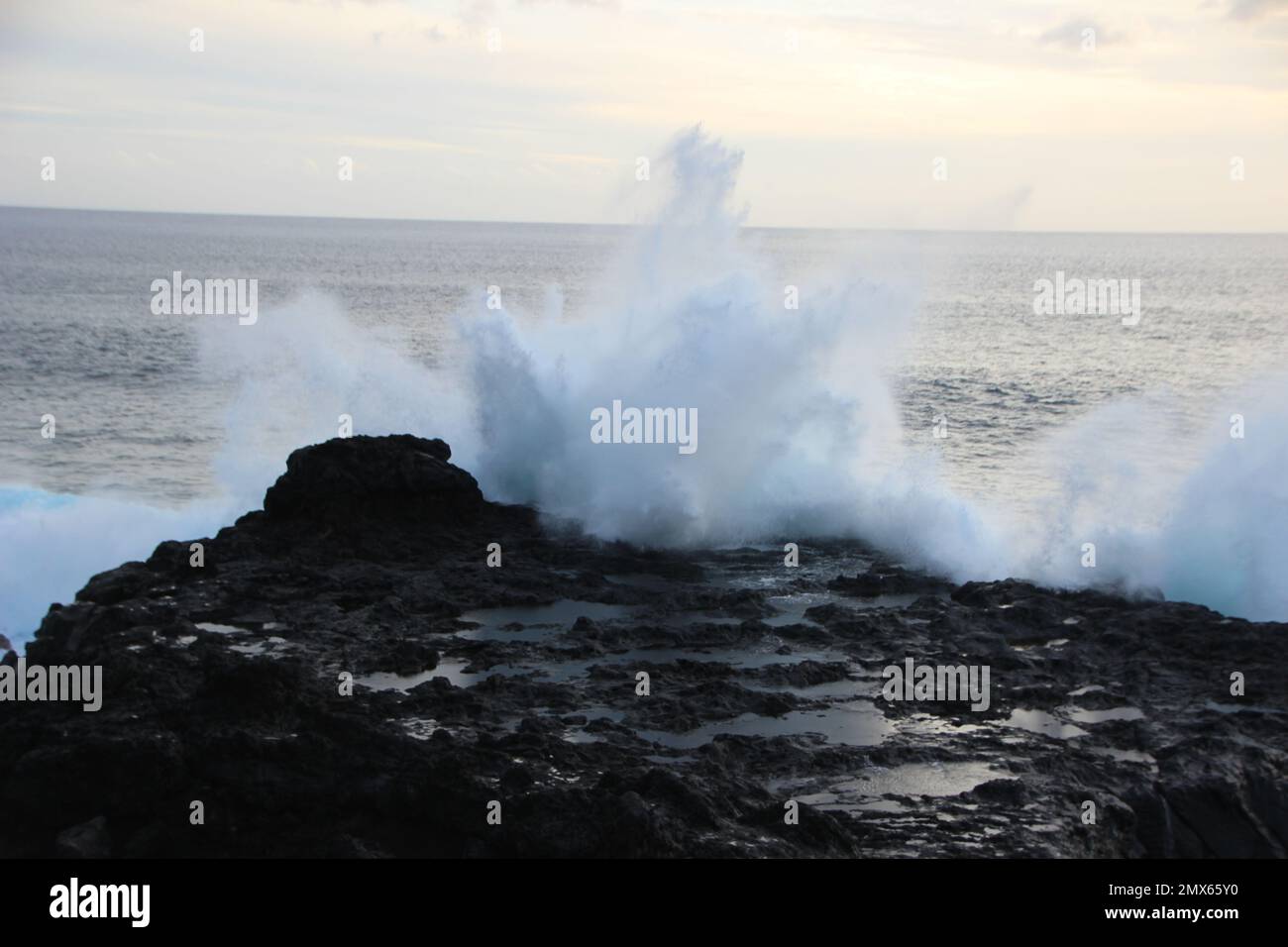 wave hitting cliff Stock Photo - Alamy