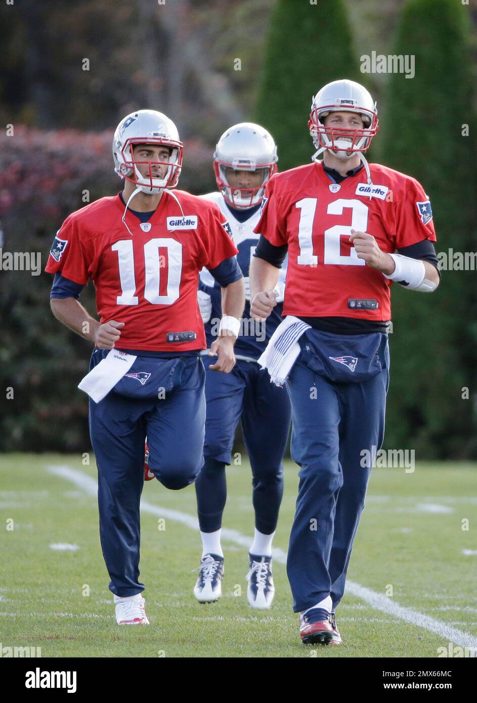 New England Patriots quarterbacks Jimmy Garoppolo (10) Tom Brady (12 ...