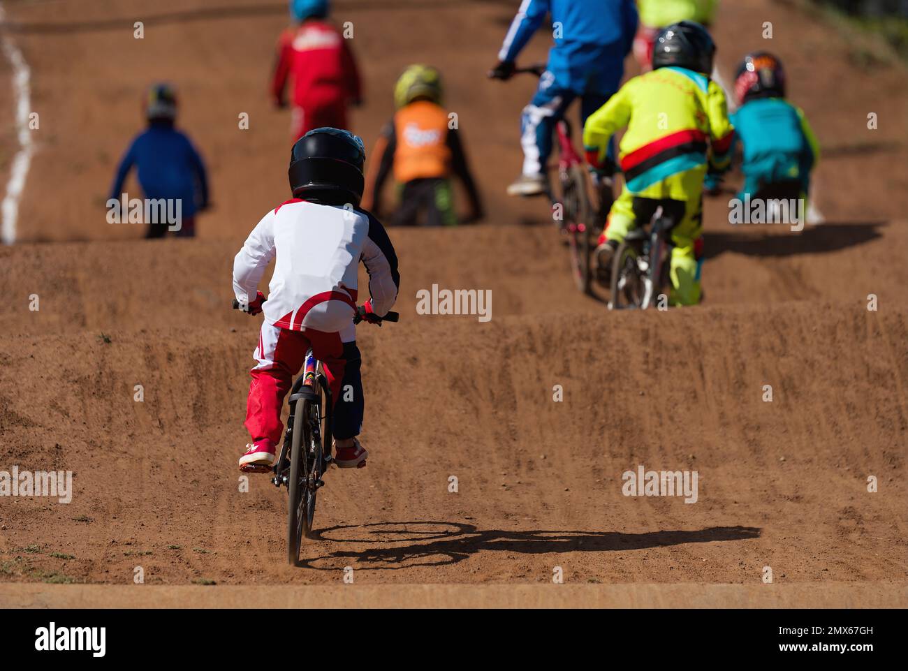 BMX riders competing in the child class on the off-road circuit Stock ...