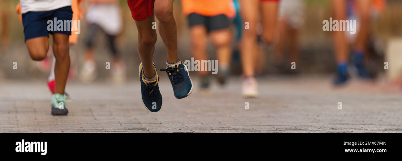 Running children, young athletes run in a kids run race,running on city ...