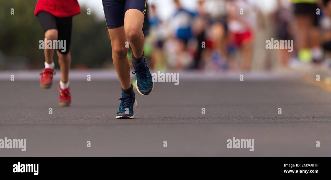 Running children, young athletes run in a kids run race,running on city ...