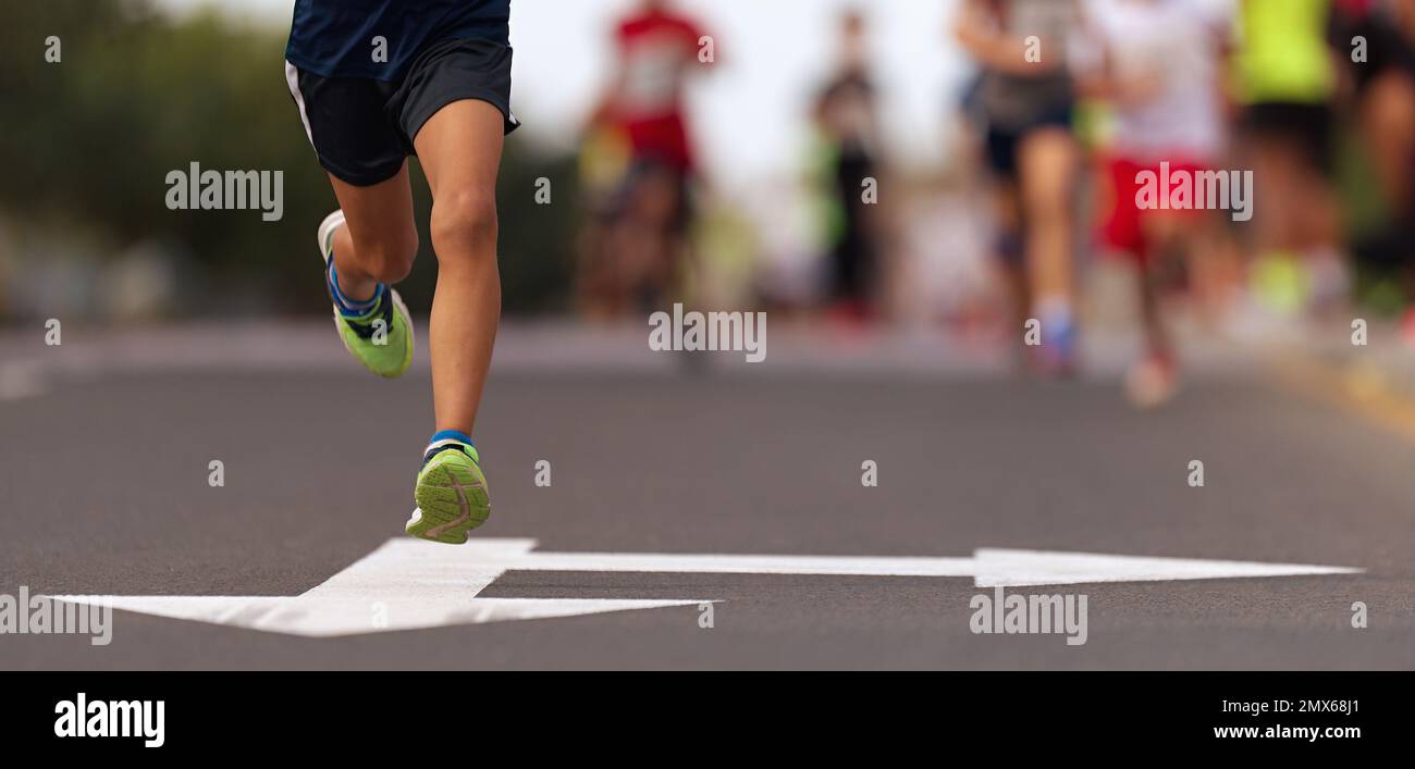 Running children, young athletes run in a kids run race,running on city ...