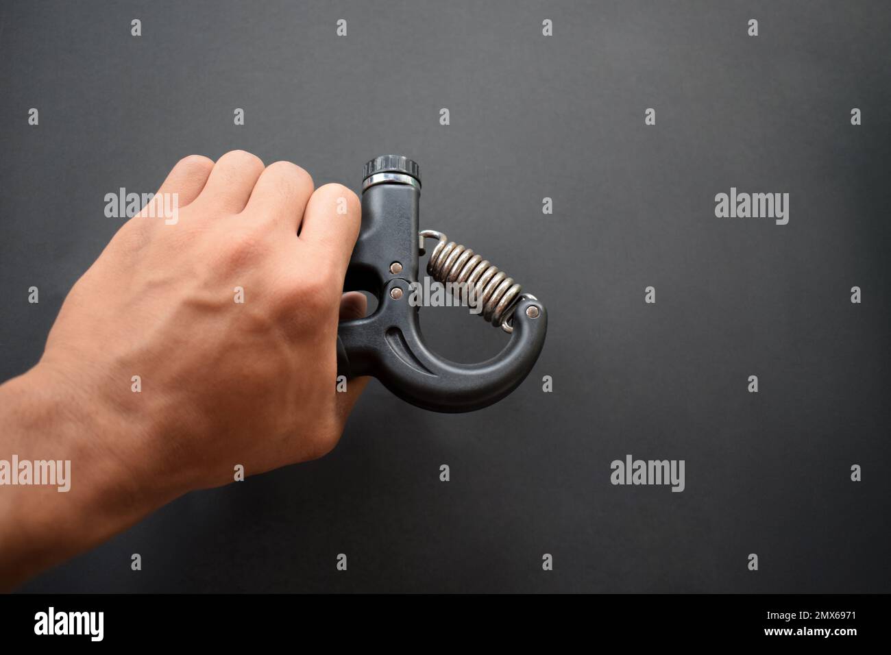 Hand squeezing a handgrip hi-res stock photography and images - Alamy