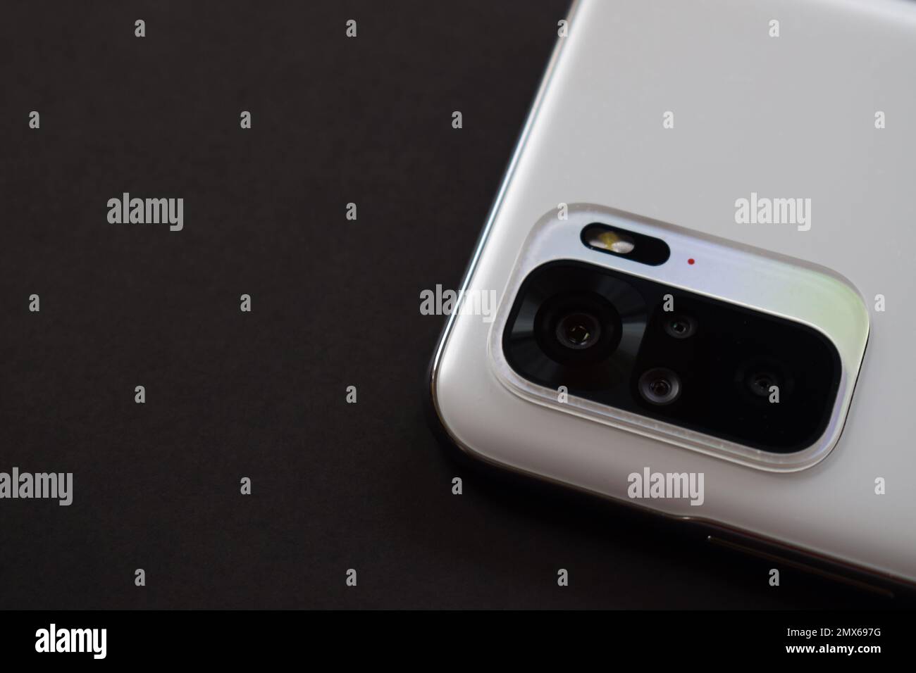 Smartphone quad camera module. New modern white smartphone with quad ...