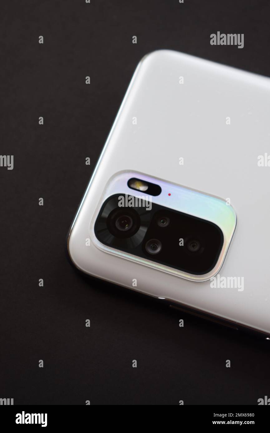 Smartphone quad camera module. New modern white smartphone with quad ...