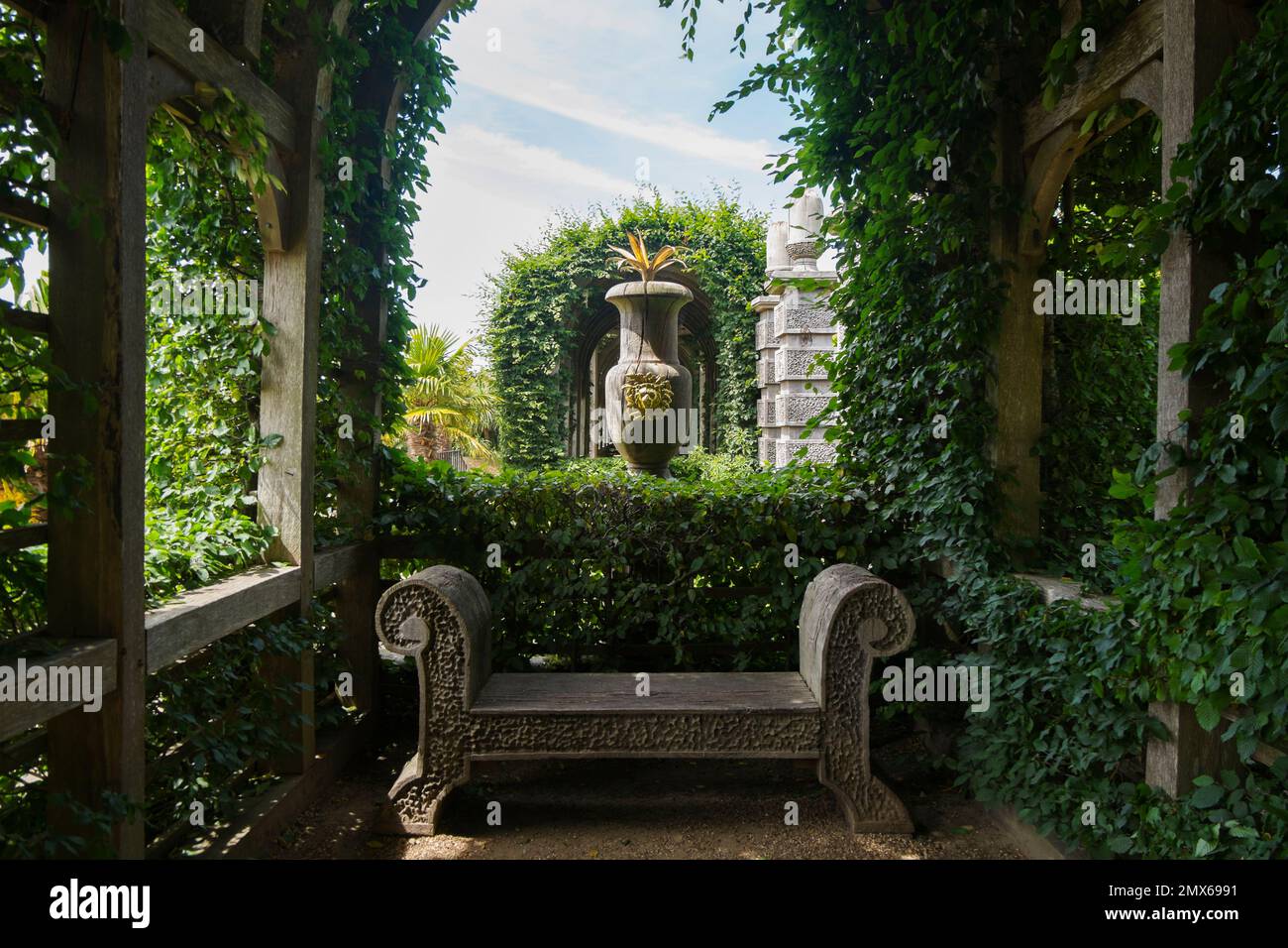 Green oak pagodas covered in Hornbeam hedging, with an ornate green oak ...