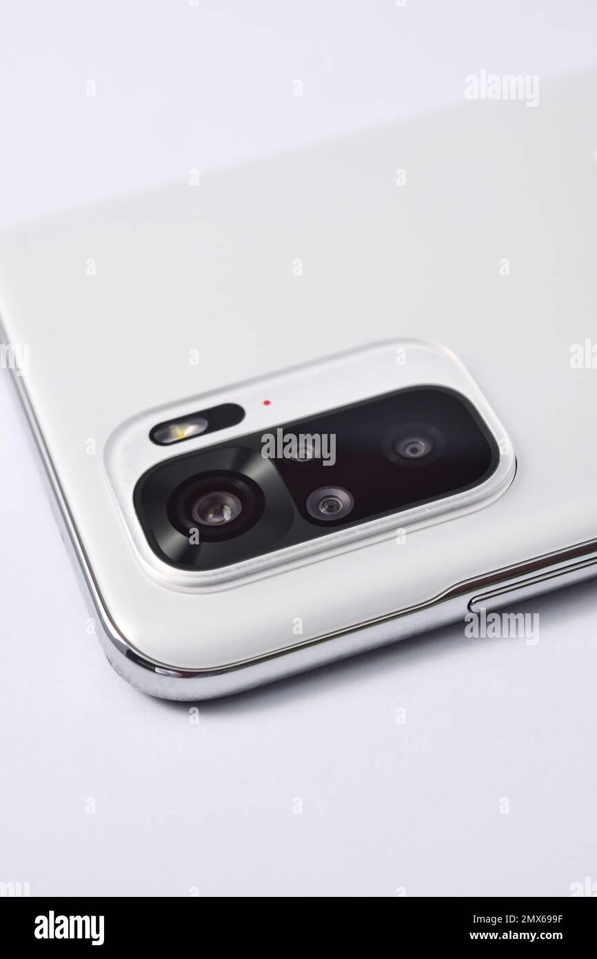 Smartphone quad camera module. New modern white smartphone with quad ...