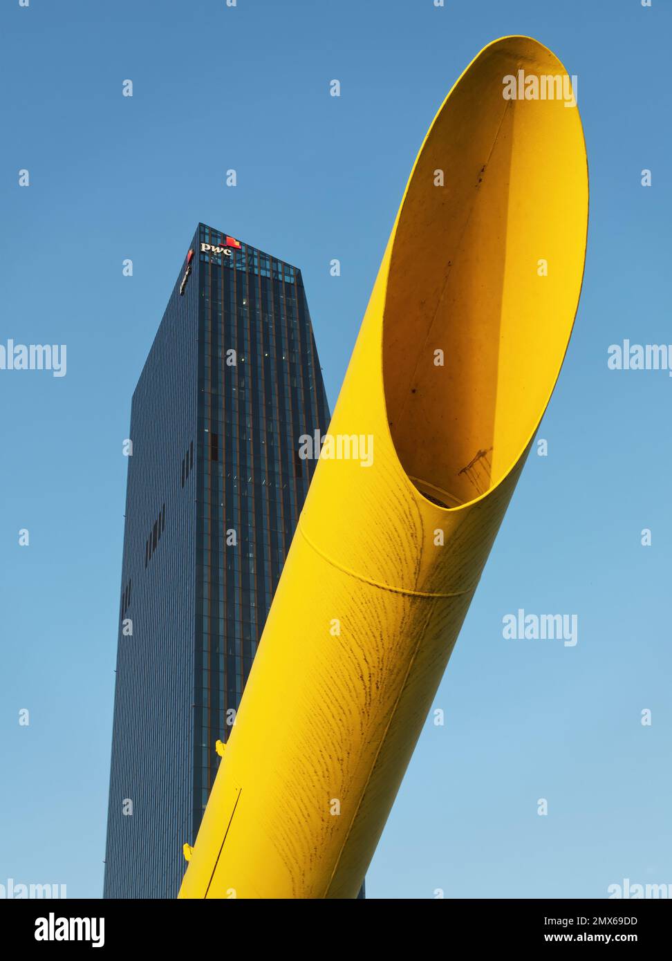 High-rise building with a yellow pipe Stock Photo - Alamy