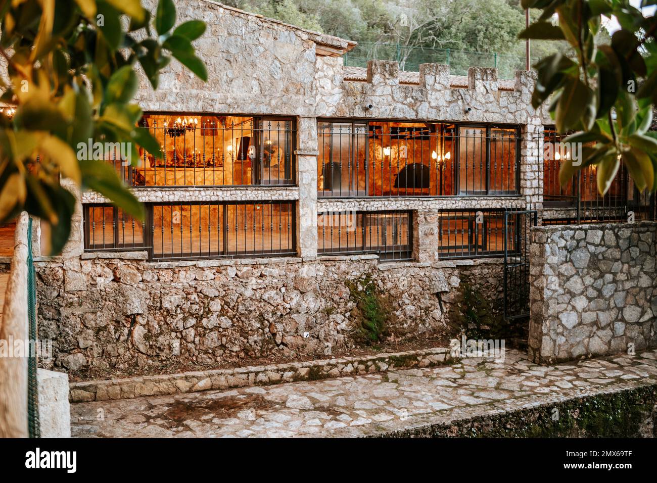 Beautiful illuminated stone building reminding a castle in nature ...