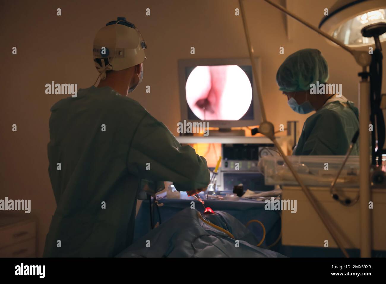 Professional doctors performing operation in surgery room Stock Photo ...