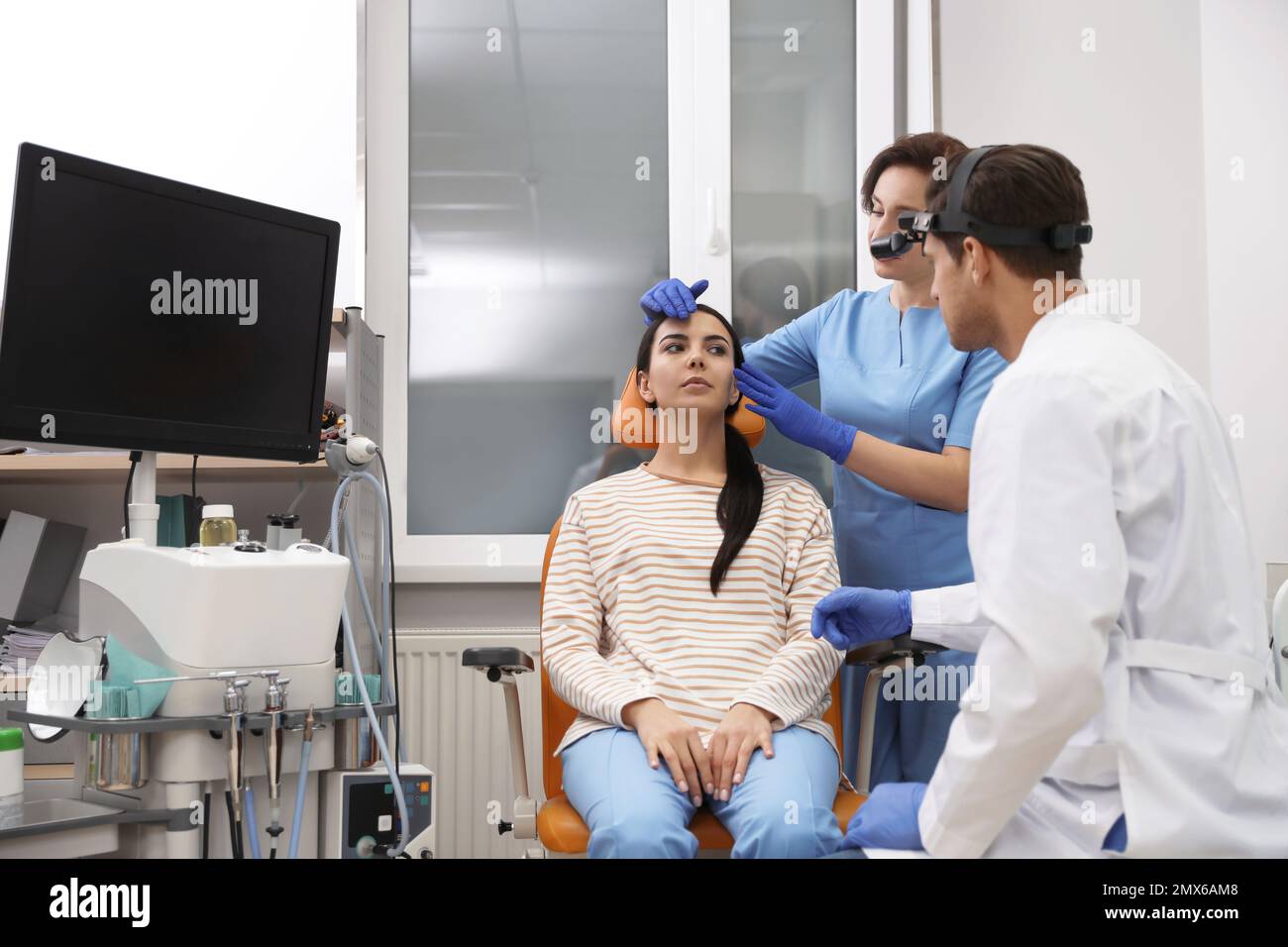 Professional doctors examining patient before surgery in clinic Stock ...