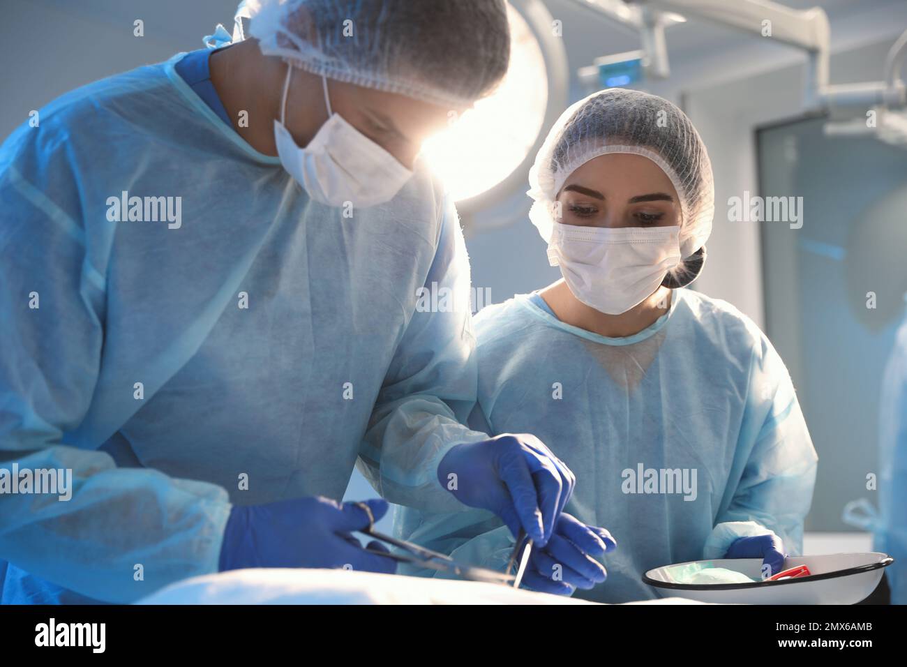 Team of professional doctors performing operation in surgery room Stock ...