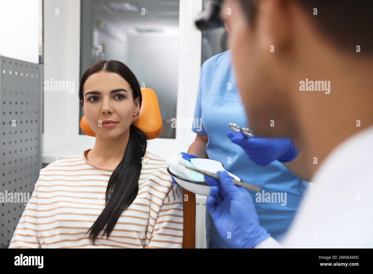 Professional doctors examining patient before surgery in clinic Stock ...