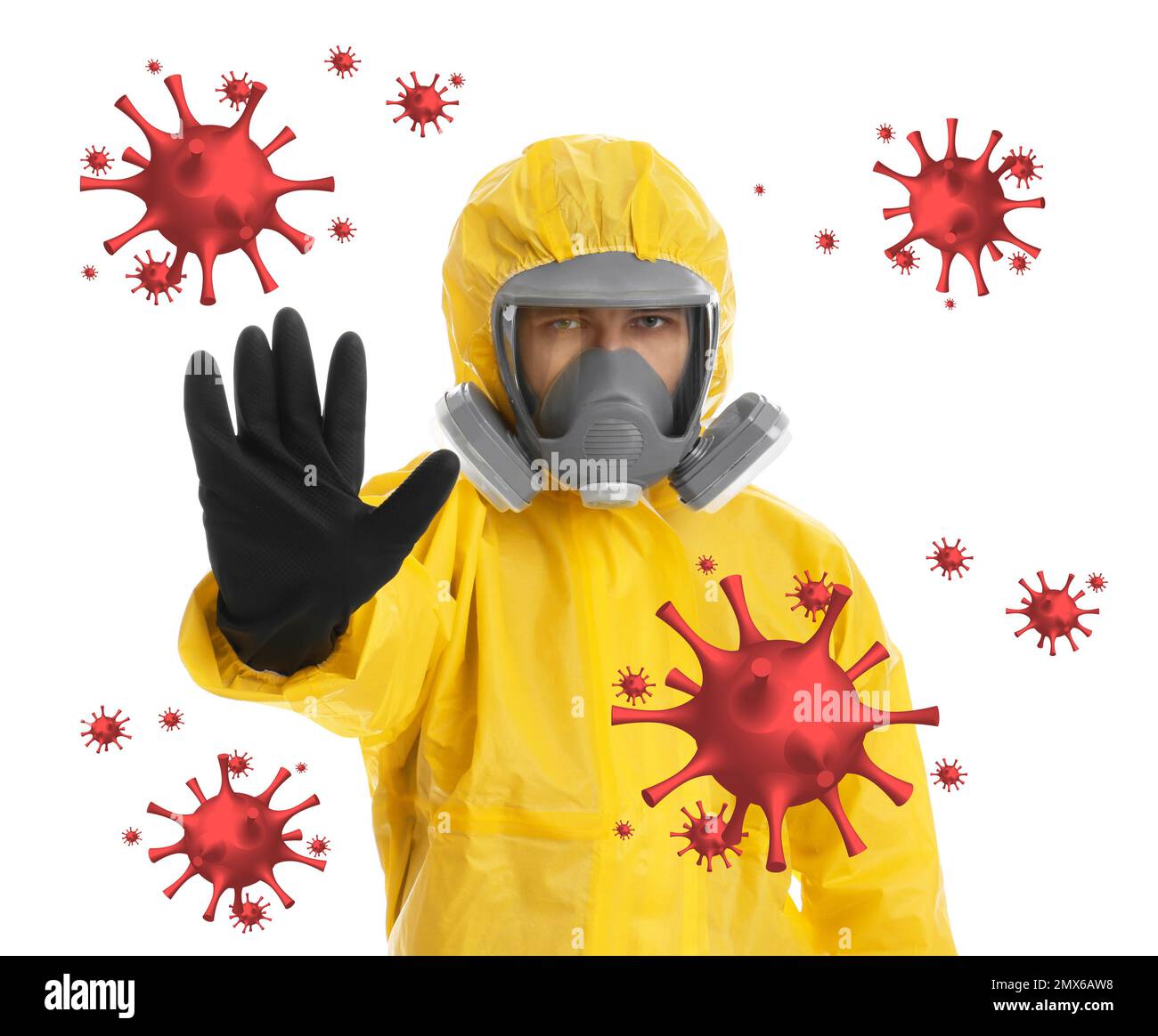 Man wearing chemical protective suit showing STOP gesture on white ...