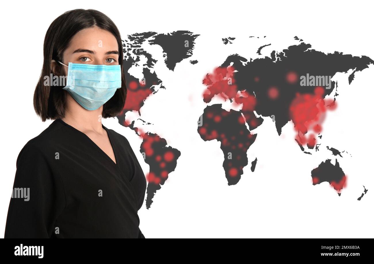 Woman with medical mask and world map showing spreading of coronavirus ...