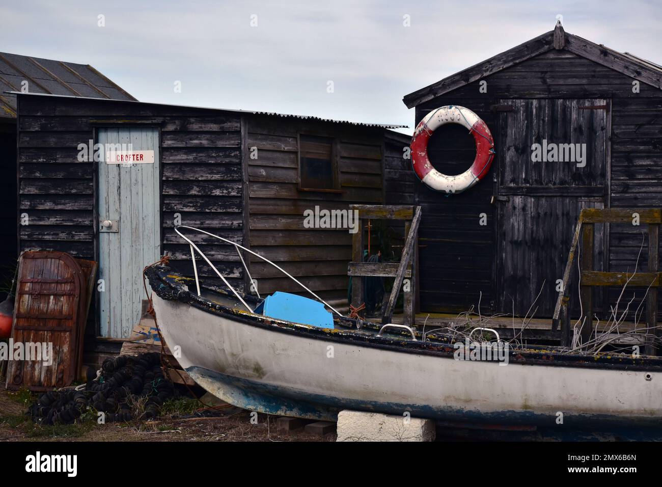 Buildings and boat alongside the River Blyth at Southwold harbour Stock ...