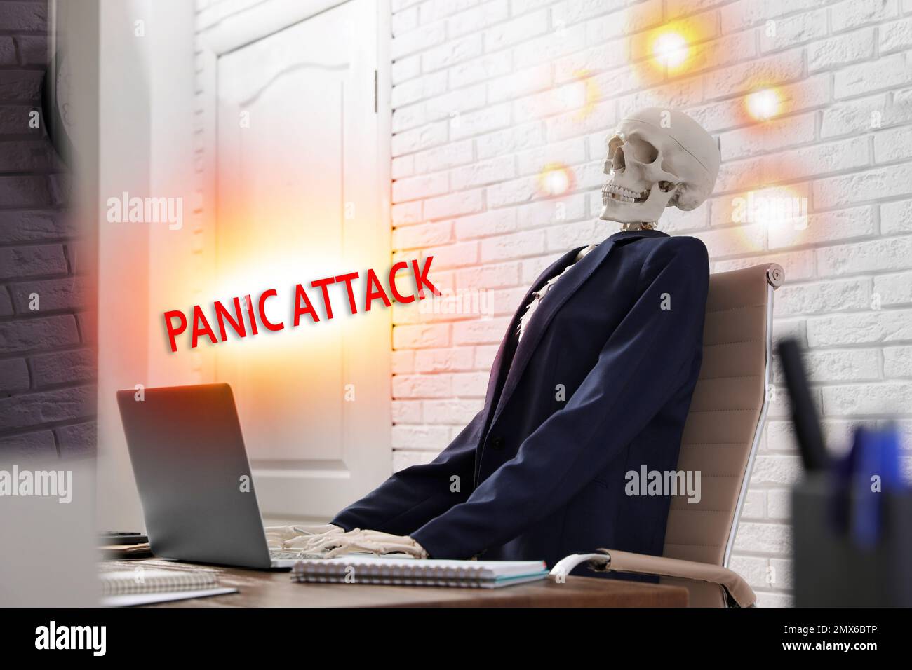 Human skeleton at table with laptop in office. Use information safely ...