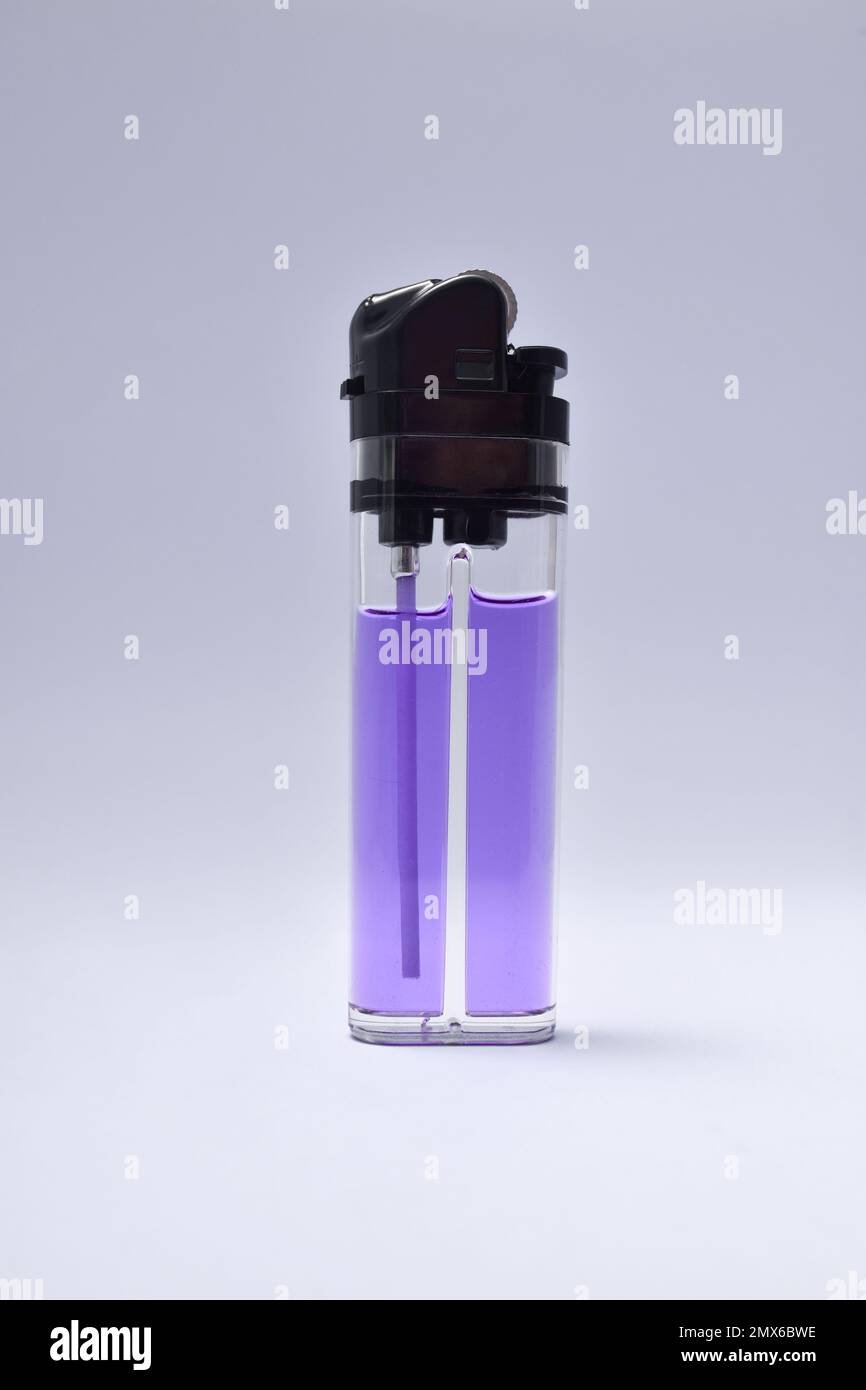 purple plastic gas lighter. Gas lighter isolated on a white background ...